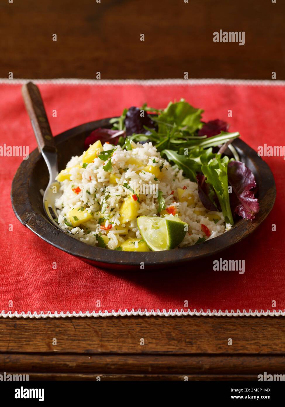 Coconut, mango and lime pilaf, served with salad leaves Stock Photo - Alamy