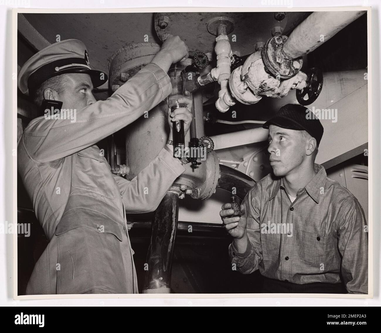 U.S. Maritime Engineer Cadets test a boiler water sample for salt ...
