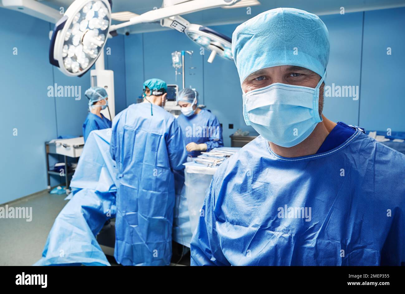 Experienced surgeon wearing PPE in operating room during surgical ...