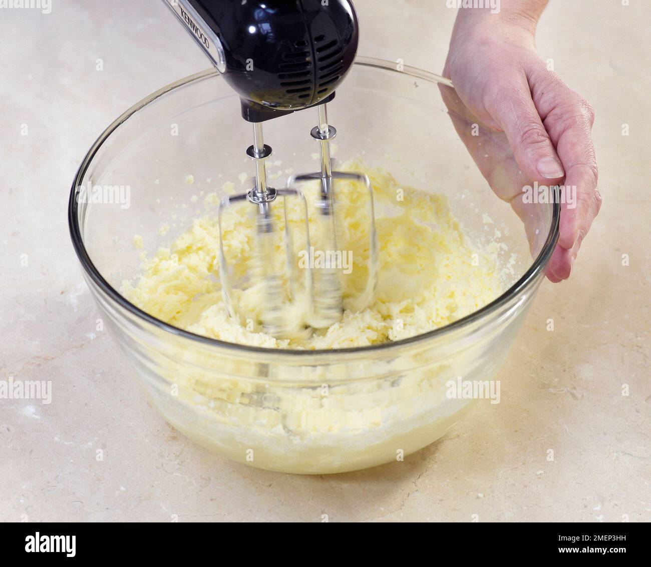 Whisking butter and sugar in bowl, making Victoria Sponge Cake Stock ...