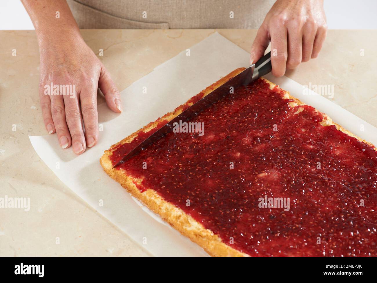 Making an indent with the back of a knife along one short side of the ...