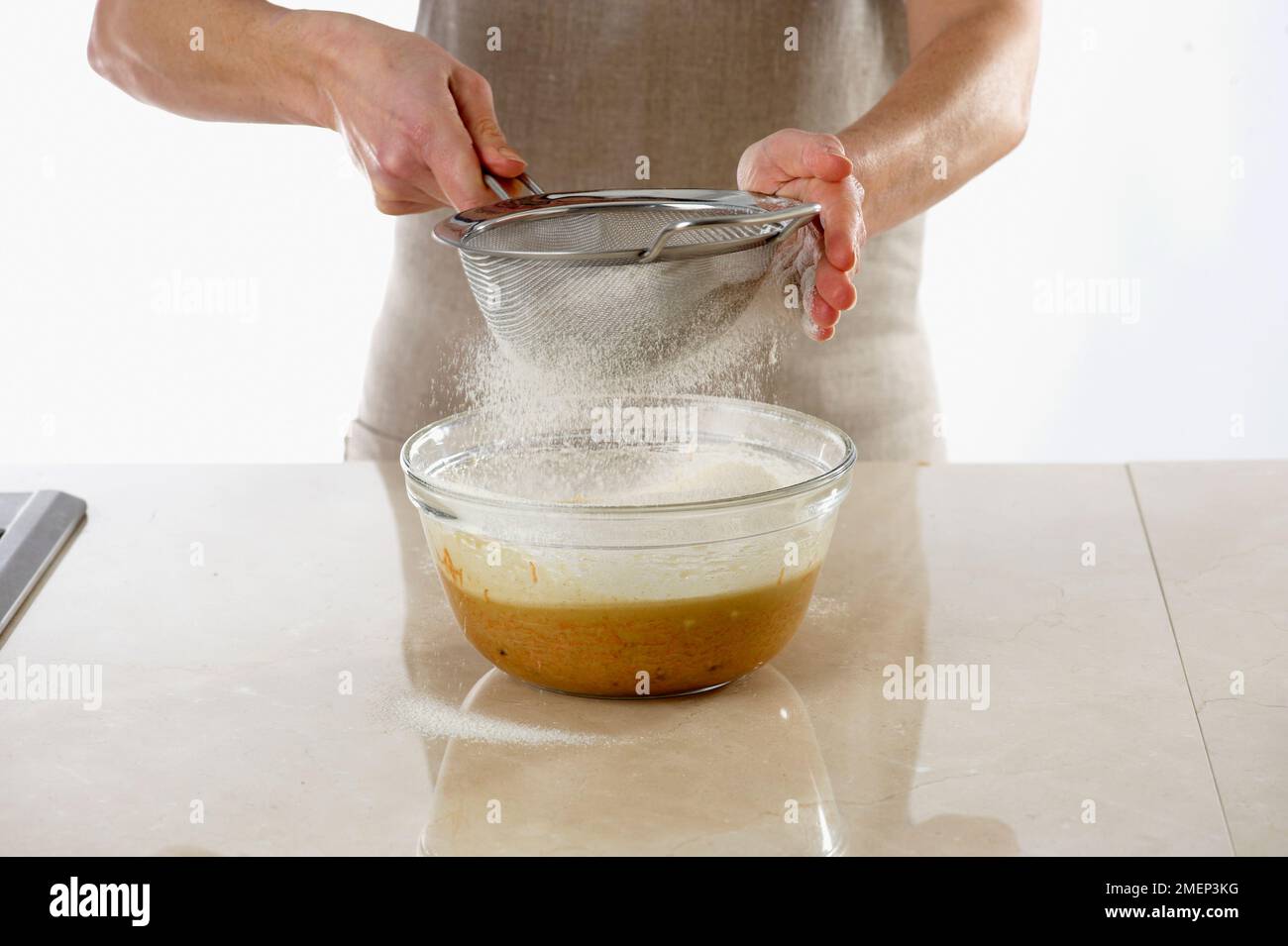 Carrot Cake, sifting flour into cake mixture Stock Photo - Alamy