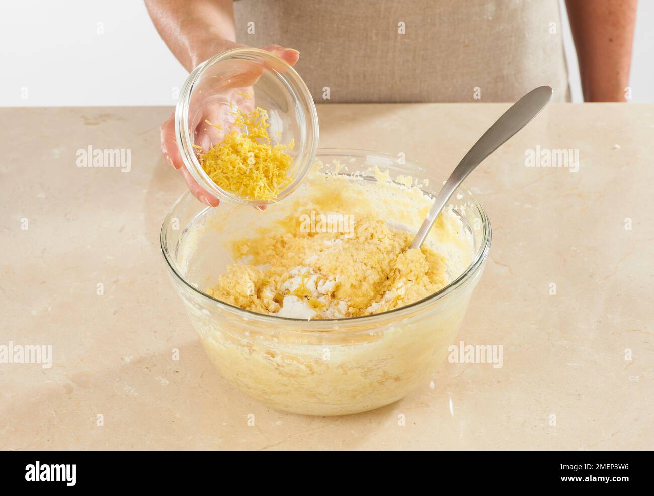 Lemon Polenta Cake, adding lemon zest to cake mixture Stock Photo - Alamy