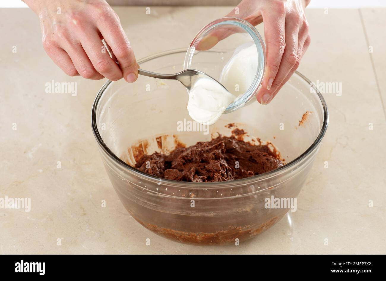 Making Chocolate Cake, adding yoghurt to cake mixture Stock Photo - Alamy
