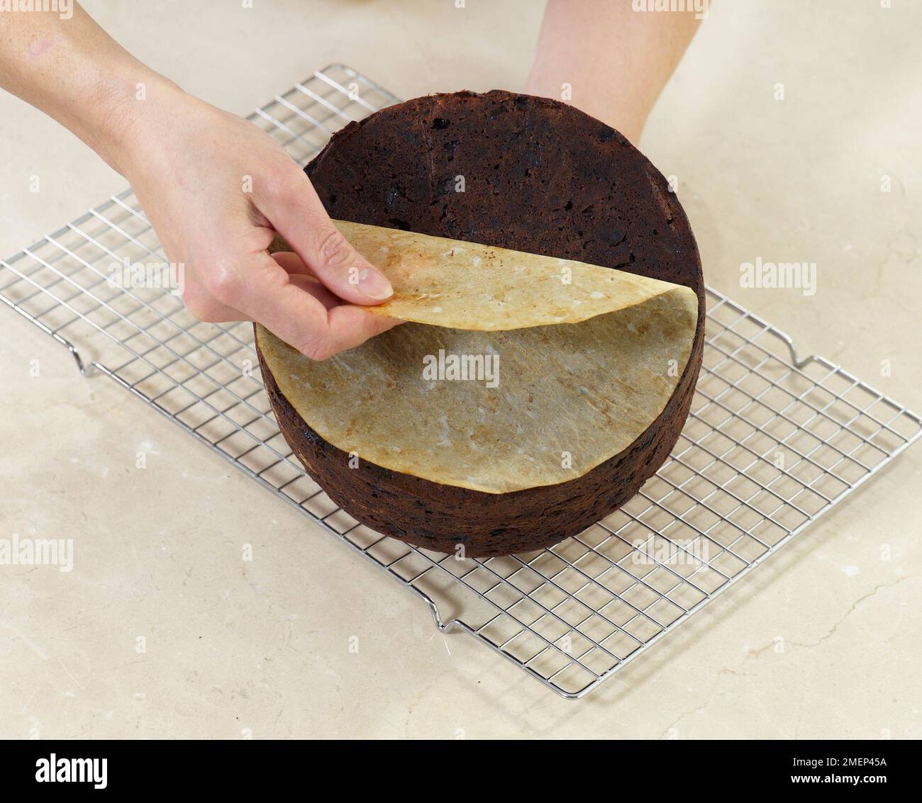 Rich Fruit Cake, removing baking parchment from bottom of cooled cake ...