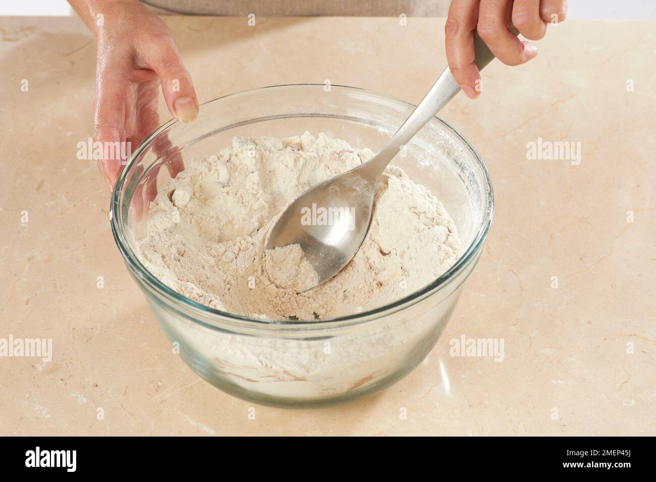 Making Banana Bread, making a well in the centre of the flour for the ...