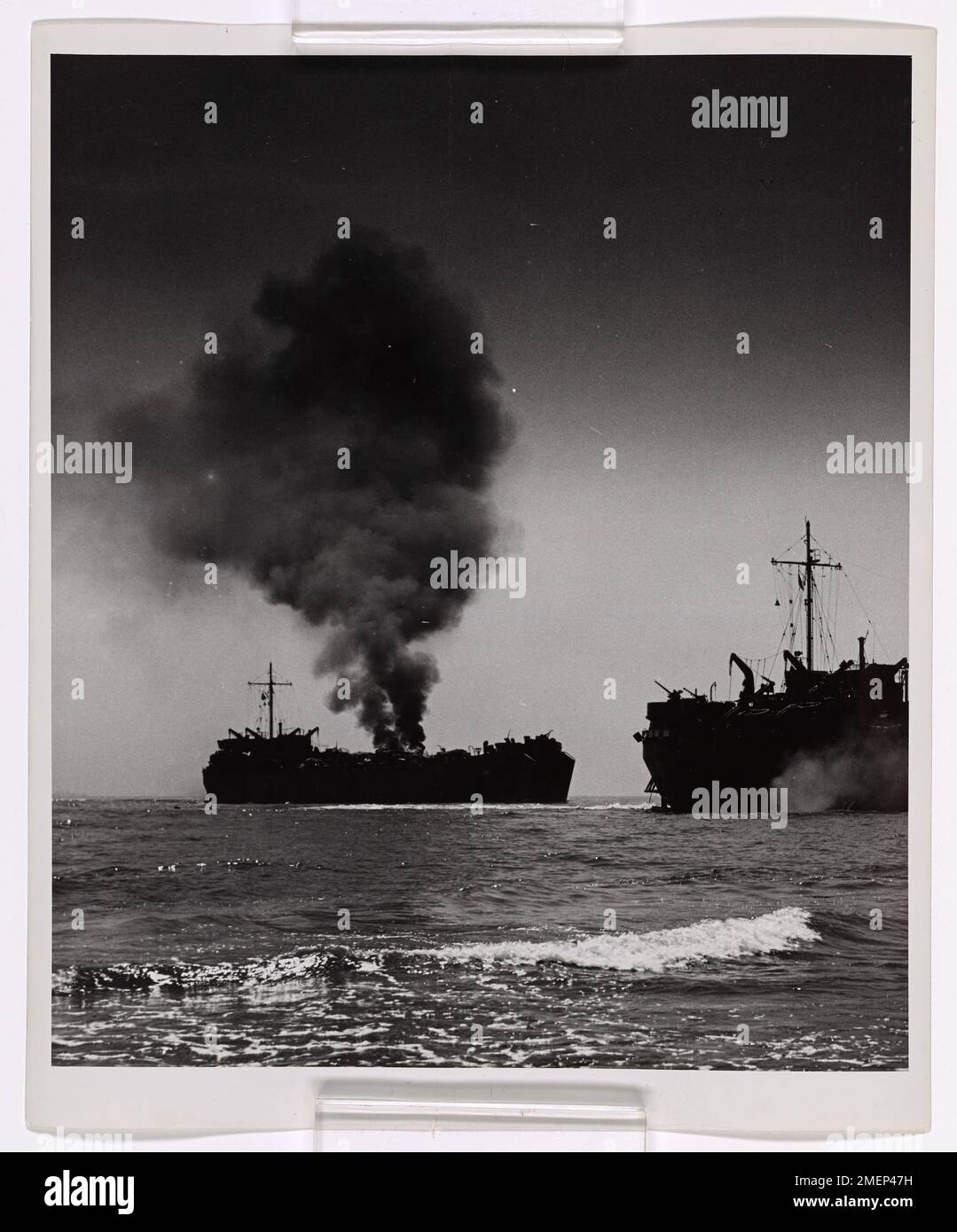 Photograph of Two Transports, One of Which Has Been Hit By Japanese ...