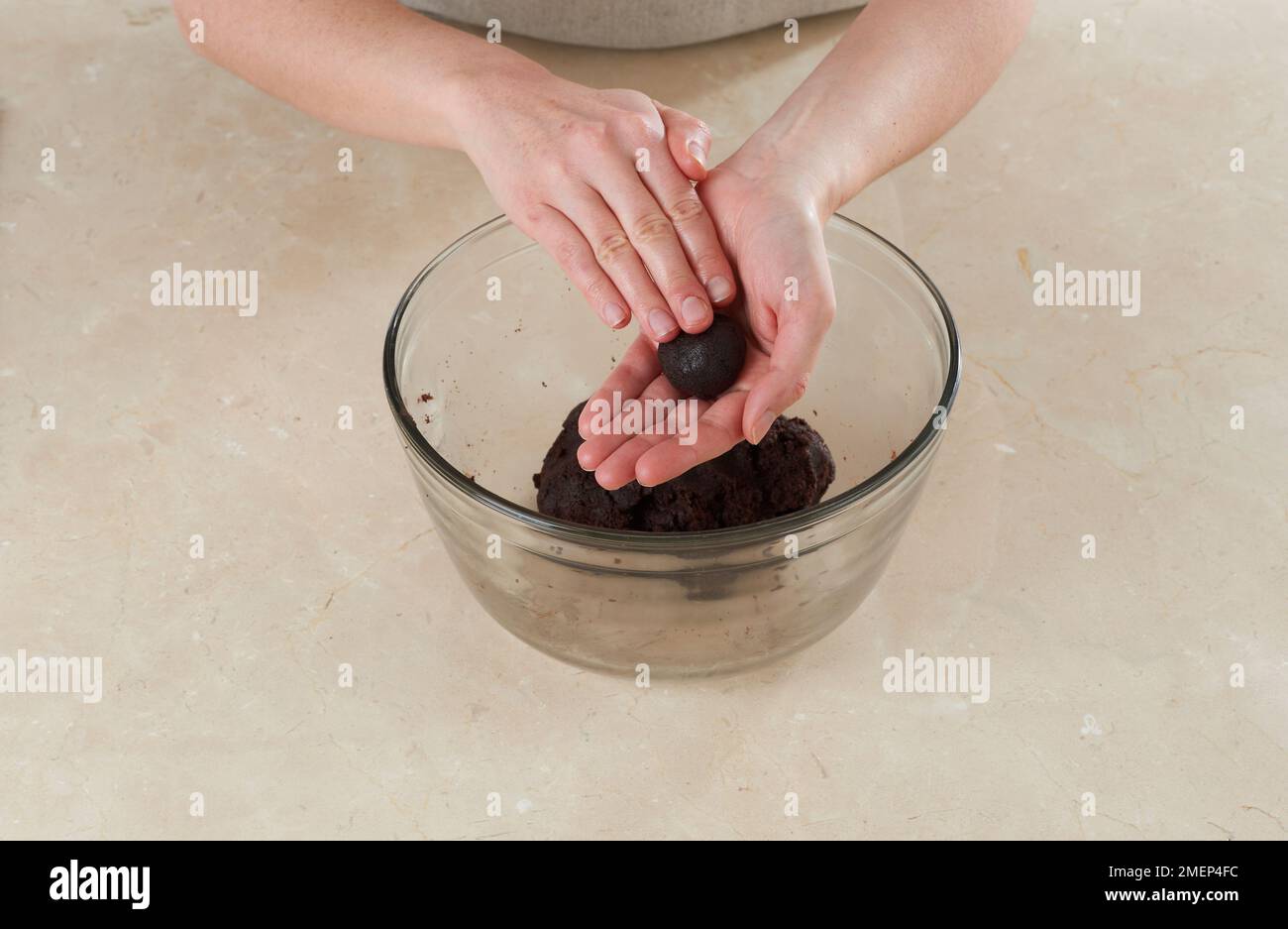 Chocolate Fudge Cake Balls, rolling cake mix into balls using hands ...