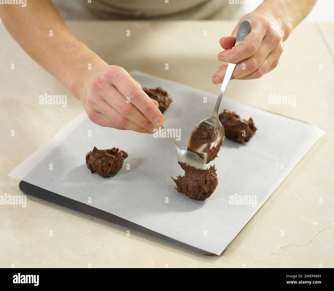 Making Whoopie Pies, spooning cake mixture on baking sheet Stock Photo ...