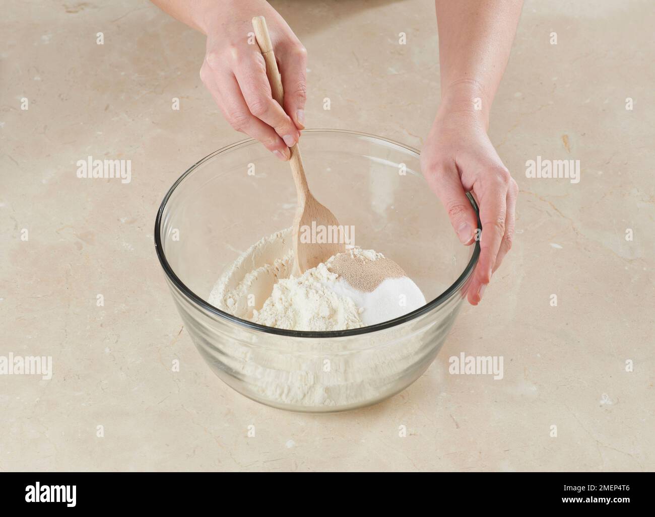 Making croissants, stirring flour, yeast, salt and sugar mixture Stock ...