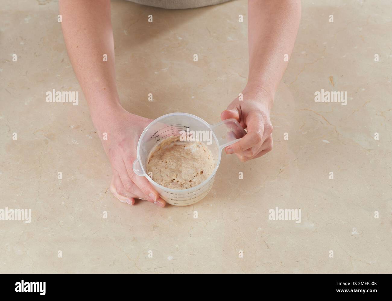 Yeast mixture in measuring jug Stock Photo - Alamy