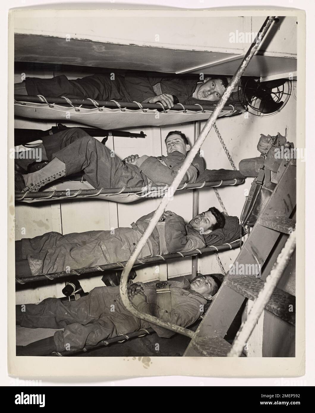 In cramped conditions aboard a Coast Guard infantry landing craft ...