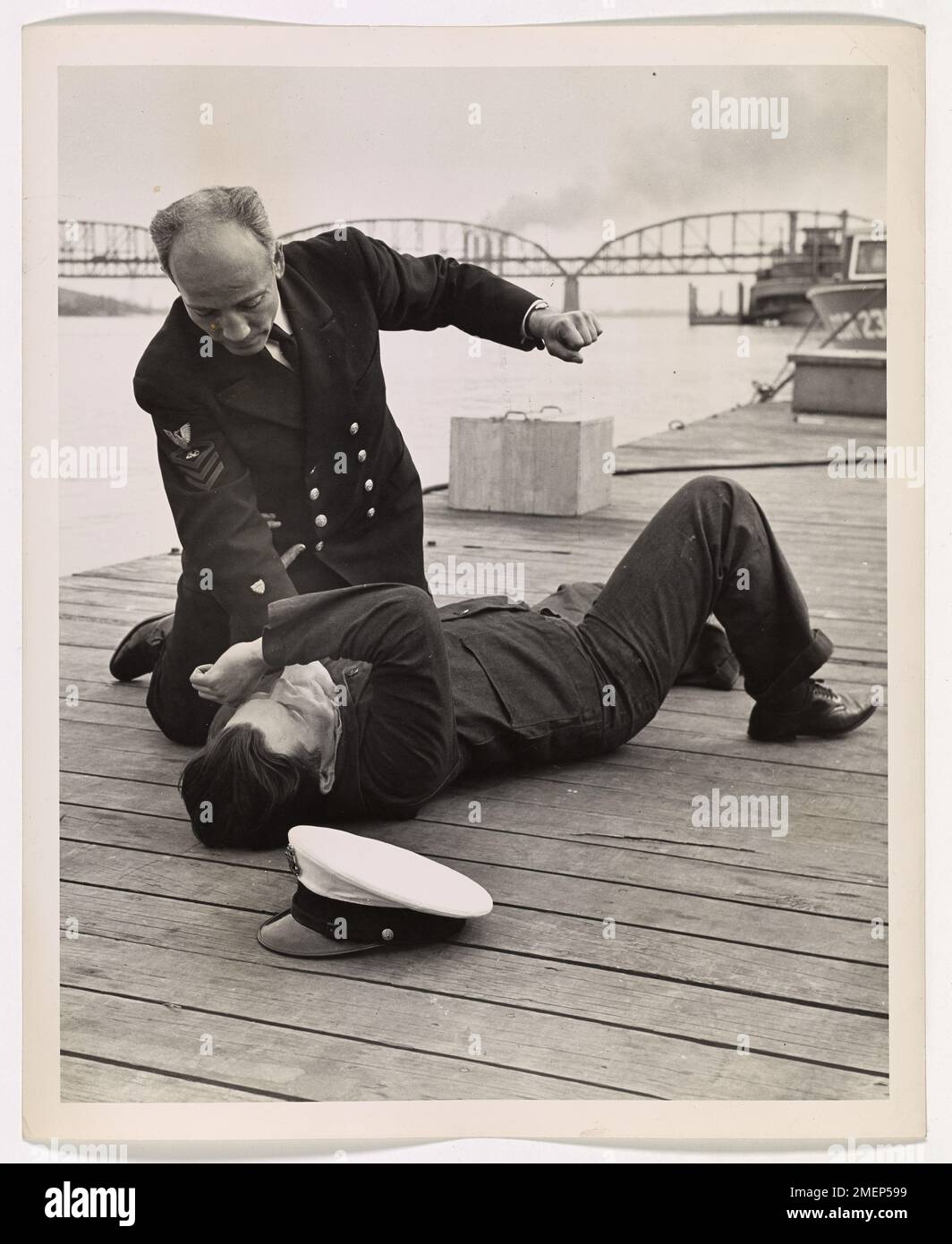 Chief Kessler rolls quickly to a kneeling position and prepares to ...