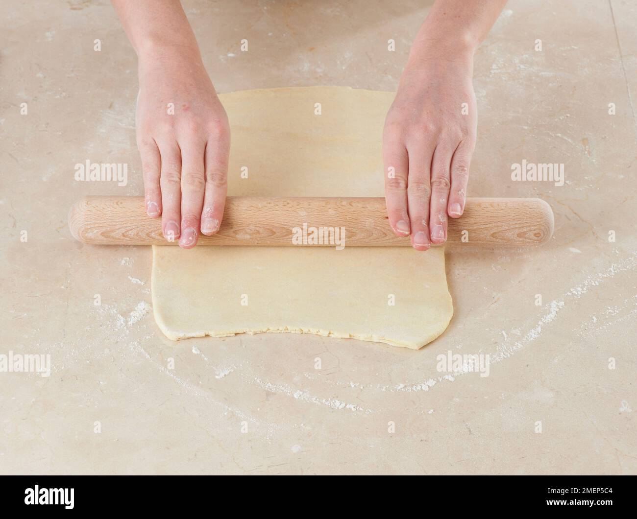 Making Cinnamon Palmiers, rolling out the dough Stock Photo - Alamy