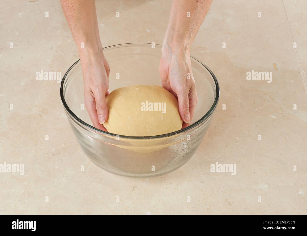 Making Doughnuts, leaving dough to rise Stock Photo - Alamy