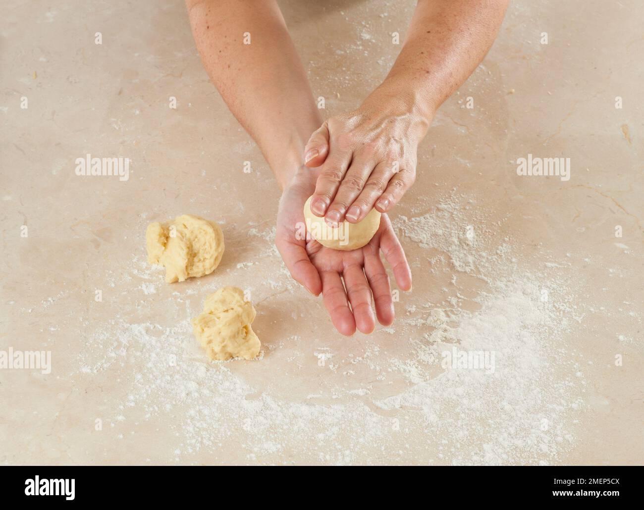 Shaping dough balls hands hi-res stock photography and images - Alamy