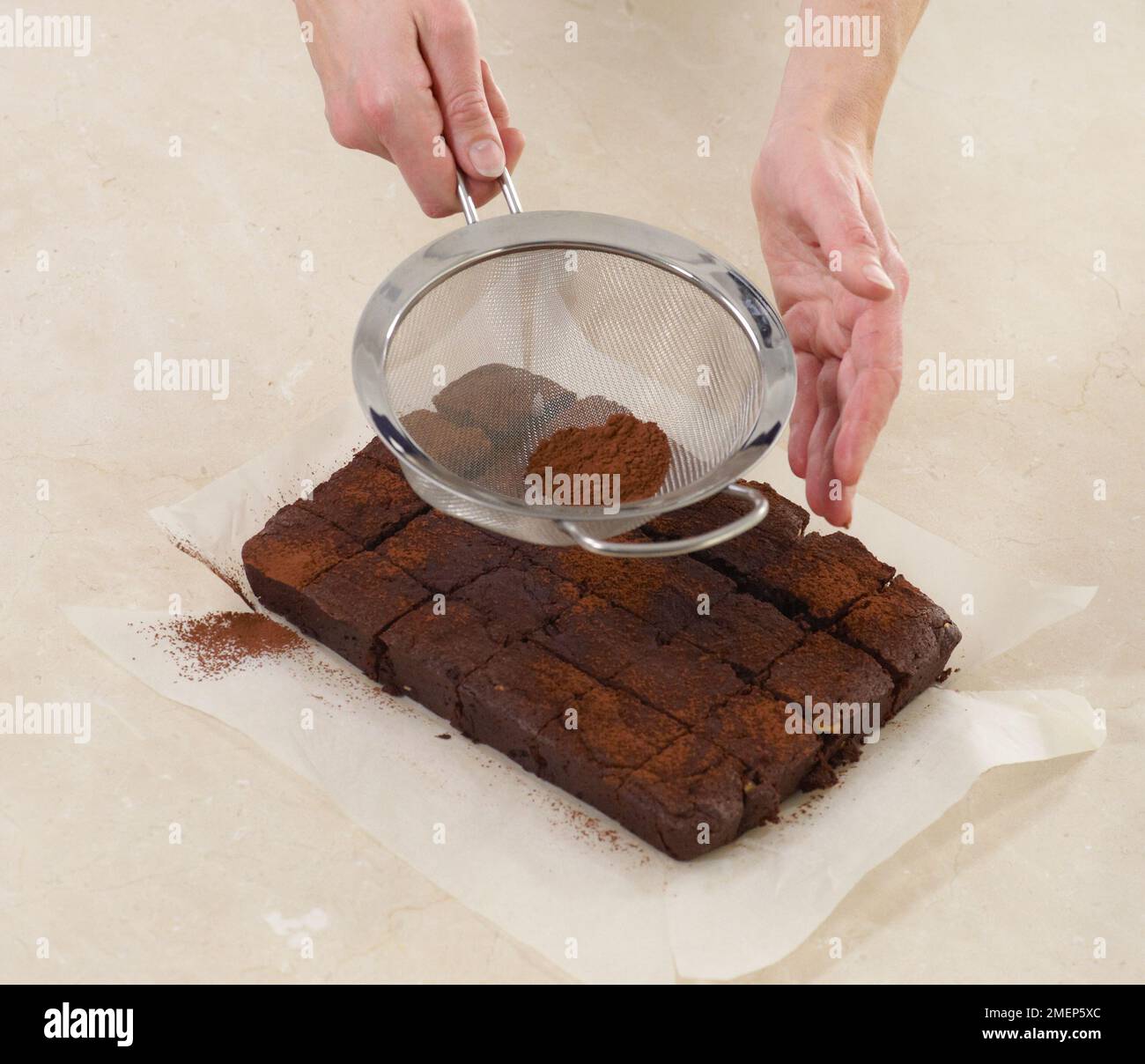 Chocolate and Hazelnut Brownies, dusting with chocolate powder Stock ...