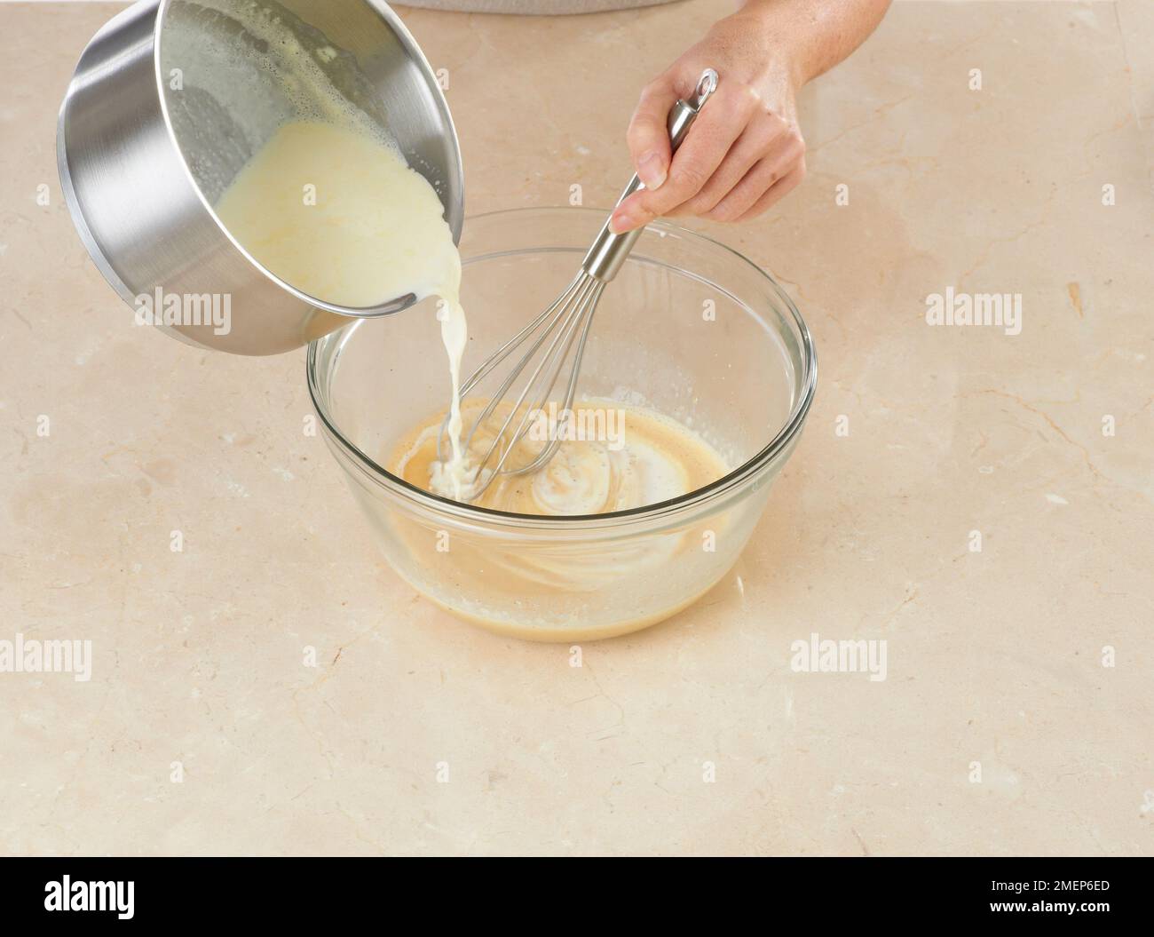 Making filling for Custard Tart, pouring hot milk and cream over egg ...