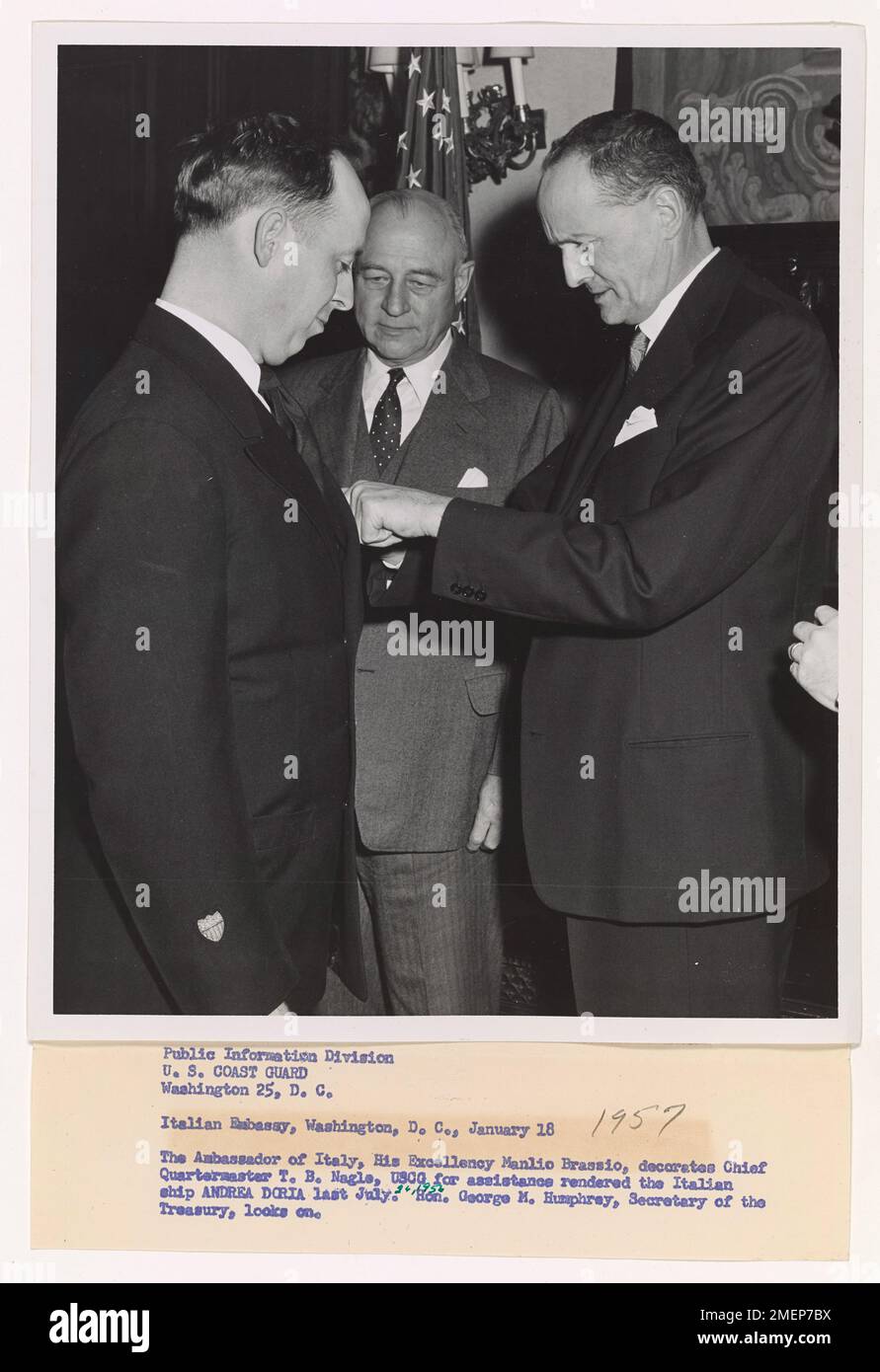 Chief Quartermaster T. B. Nagle of the U.S. Coast Guard is decorated by ...