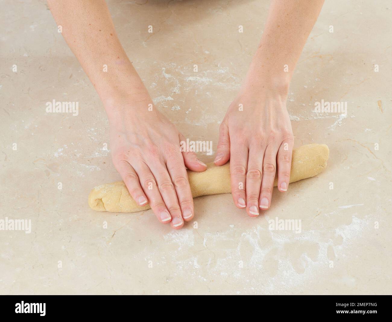 Rolling Hefezopf dough using palm of hand Stock Photo - Alamy