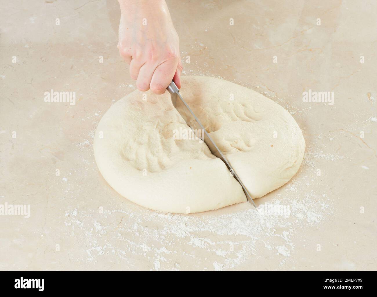 Sourdough Loaf, cutting dough in half Stock Photo - Alamy