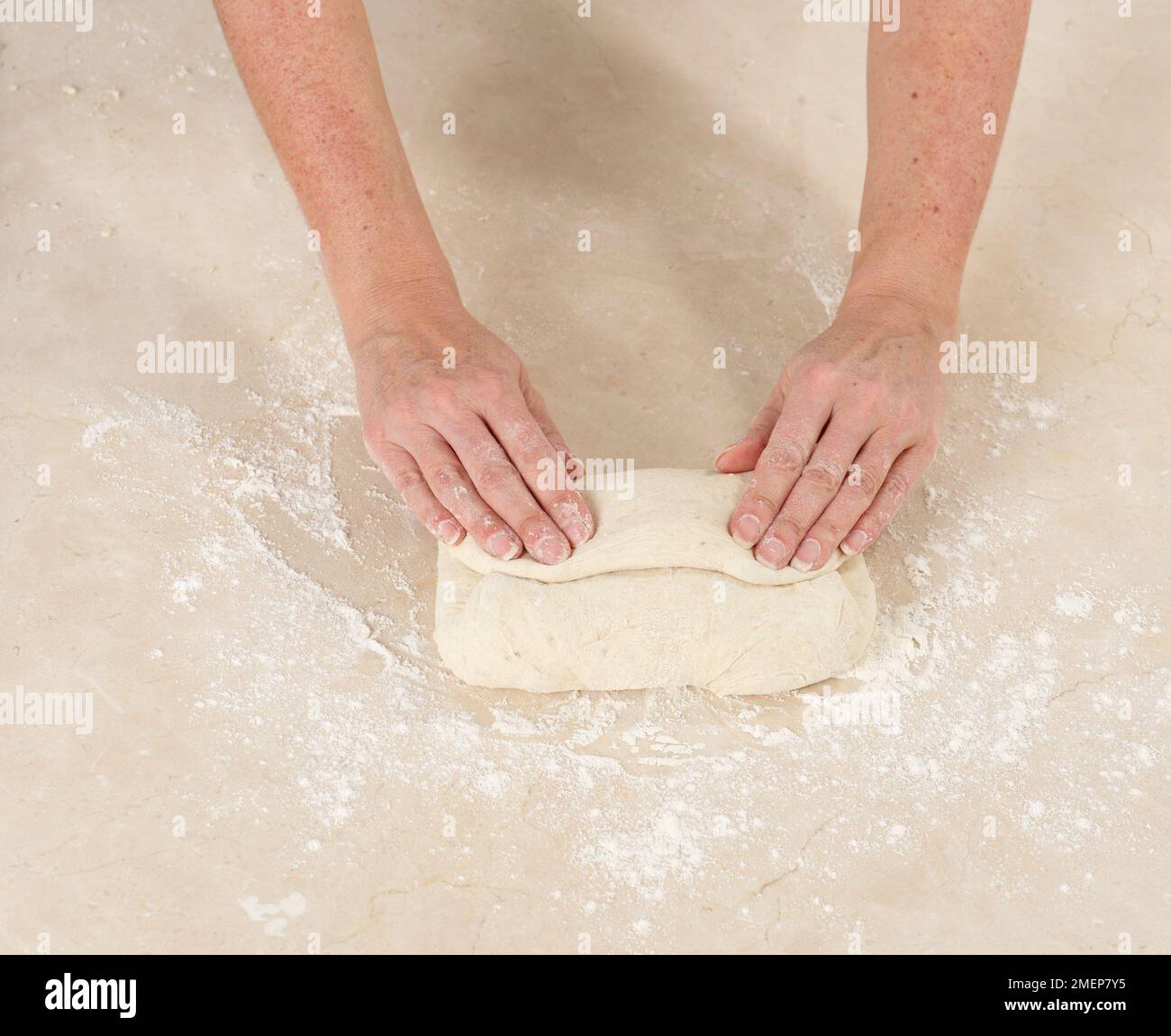 Shaping Baguette dough using hands Stock Photo - Alamy