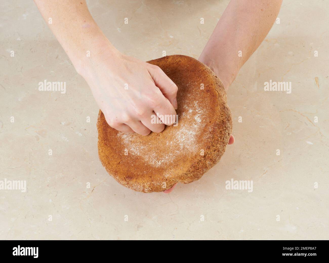 Turning the bread hi-res stock photography and images - Alamy