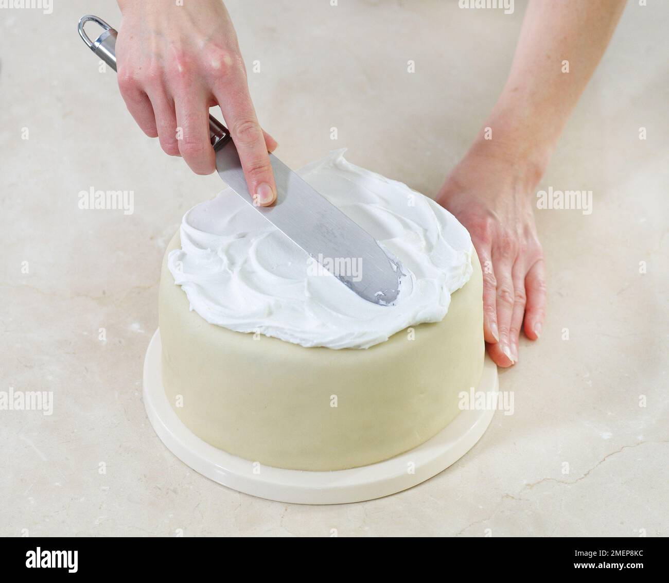 Rich Fruit Cake, covering cake with icing using palette knife Stock ...