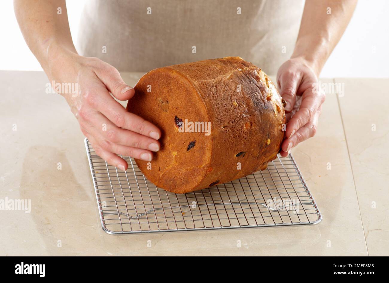 Holding baked Panettone on wire cooling tray Stock Photo - Alamy