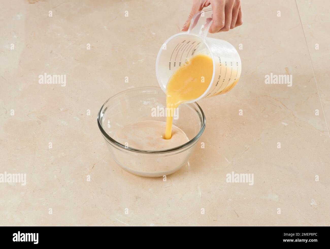 Making Brioche des rois, adding eggs to yeast, warm water and sugar ...