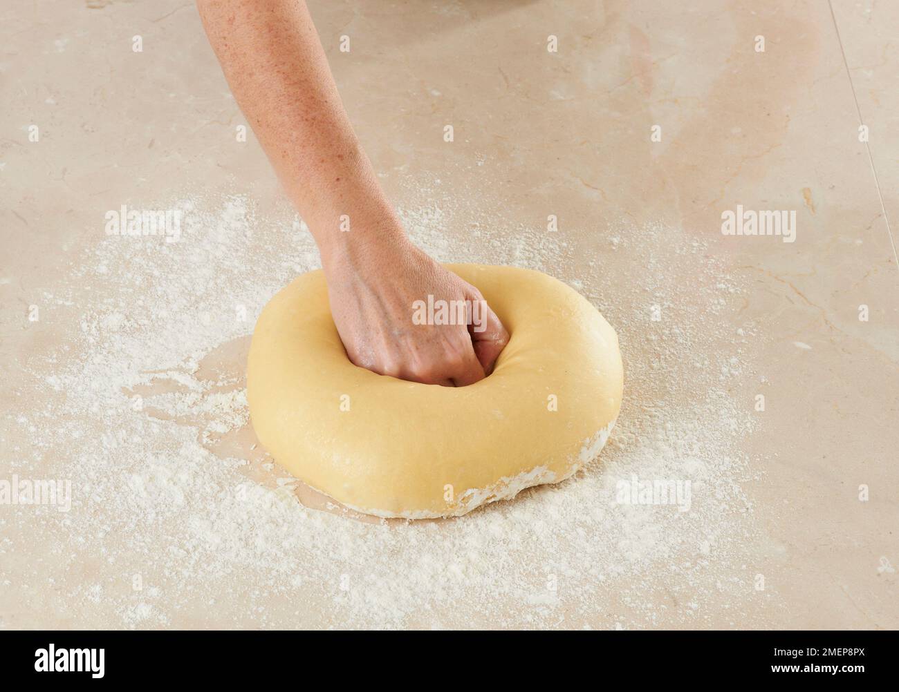 Brioche des rois, knocking dough back on floured surface Stock Photo ...
