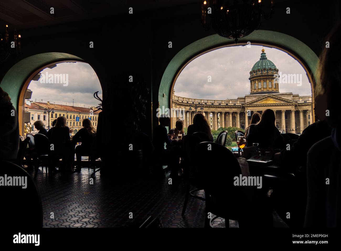 View of Kazan Cathedral from Singer Cafe through window. Silhouettes of ...