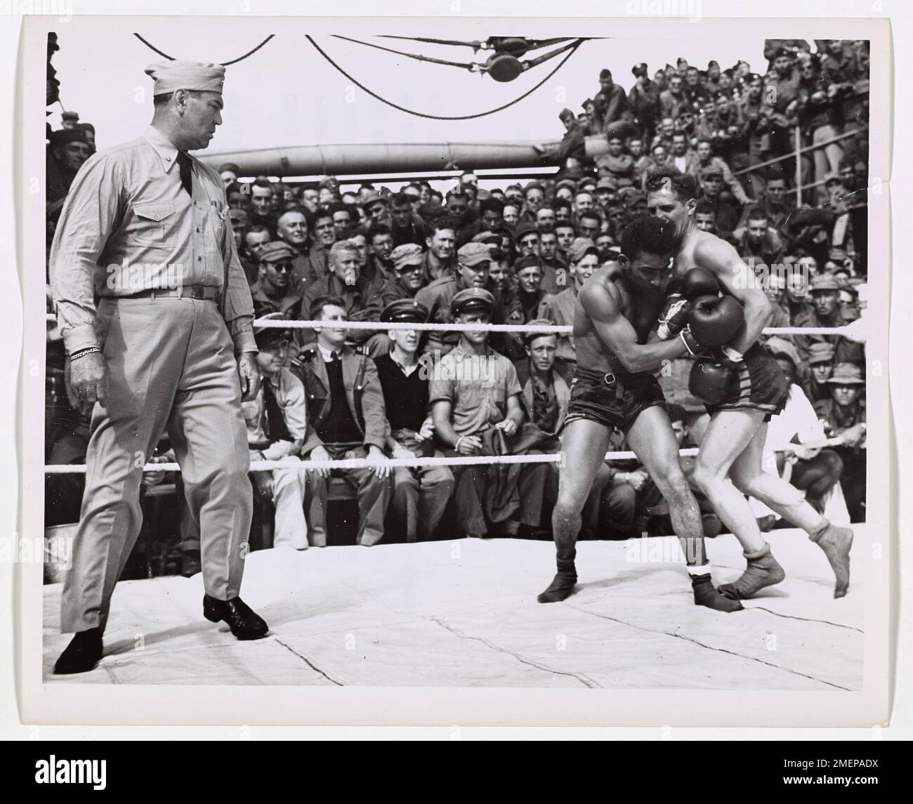Former boxing champion Jack Dempsey serves as the referee for a ...