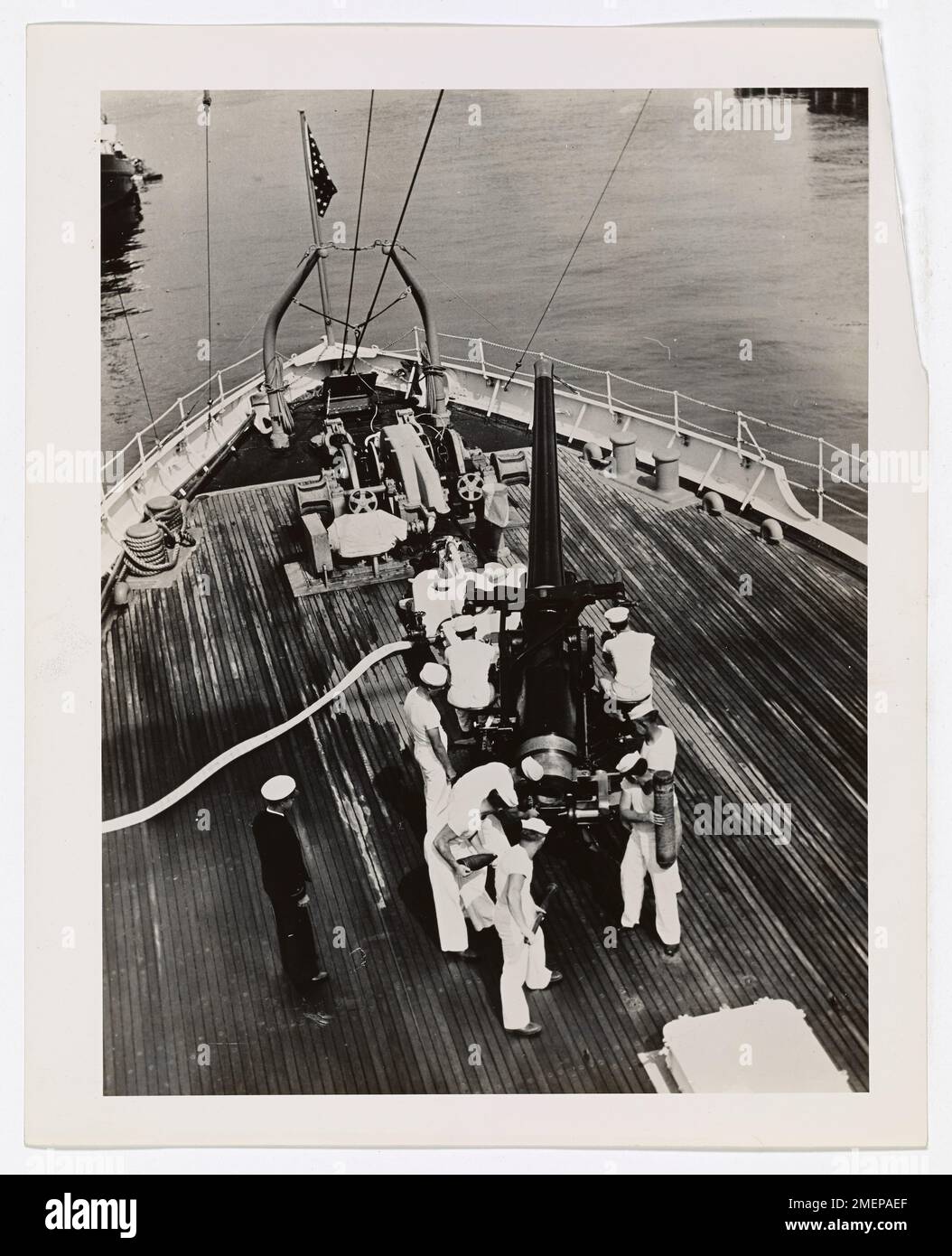 U.S. Coast Guardsmen engage in battle practice aboard a ship. The drill ...