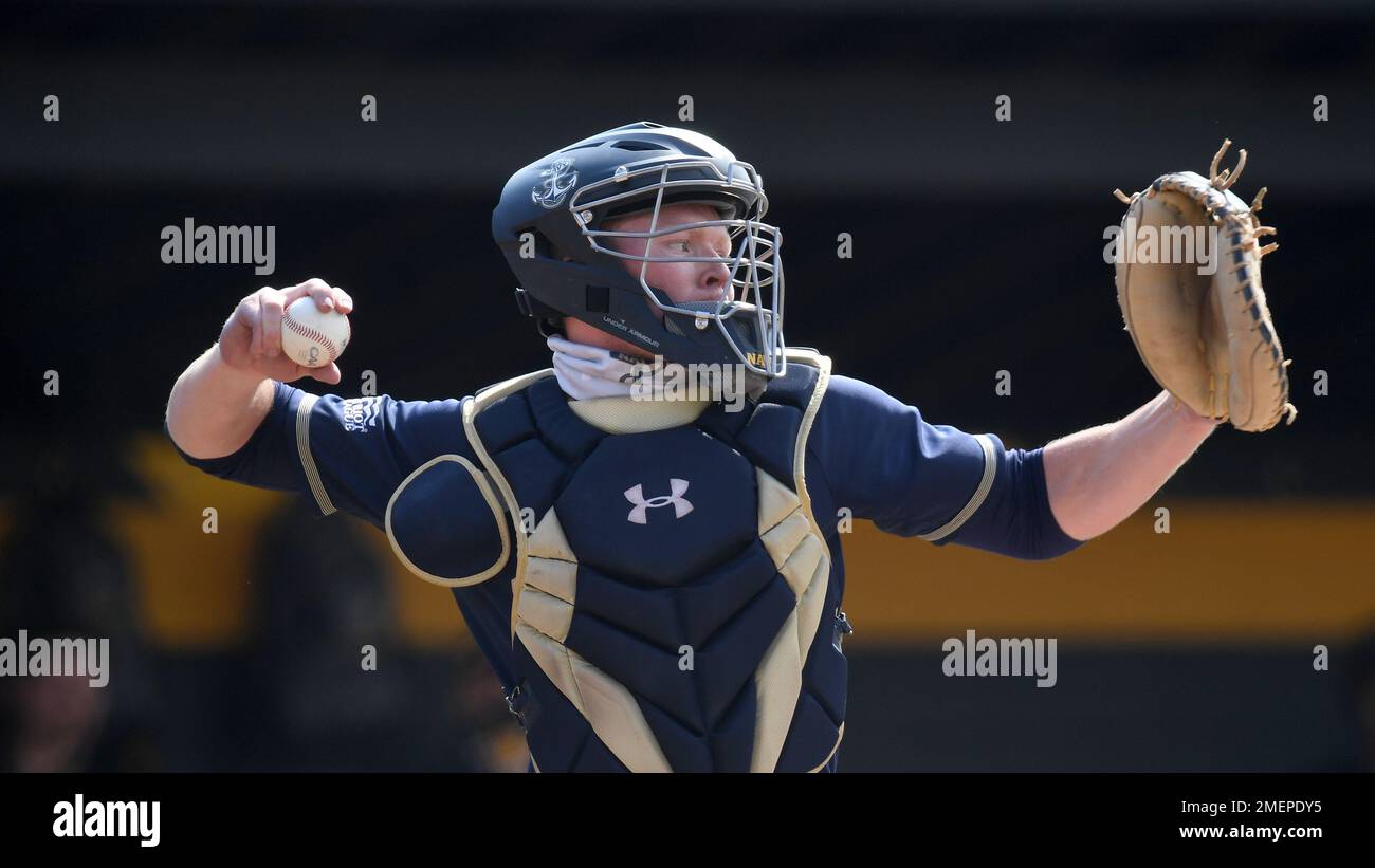 Navy catcher Alex Smith (33) warms up between innings against Towson ...