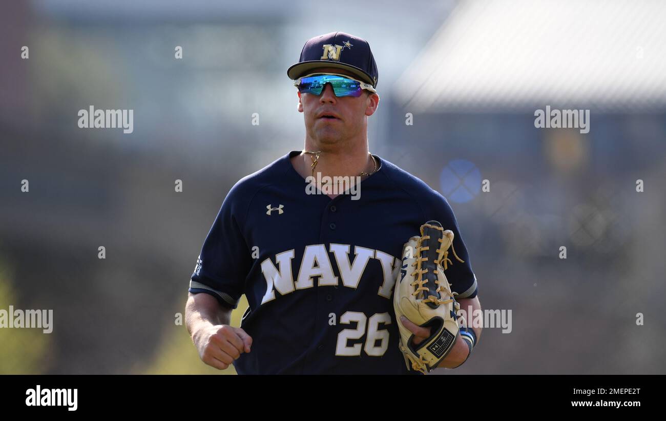 Navy outfielder Christian Policelli (26) runs off the field after an ...