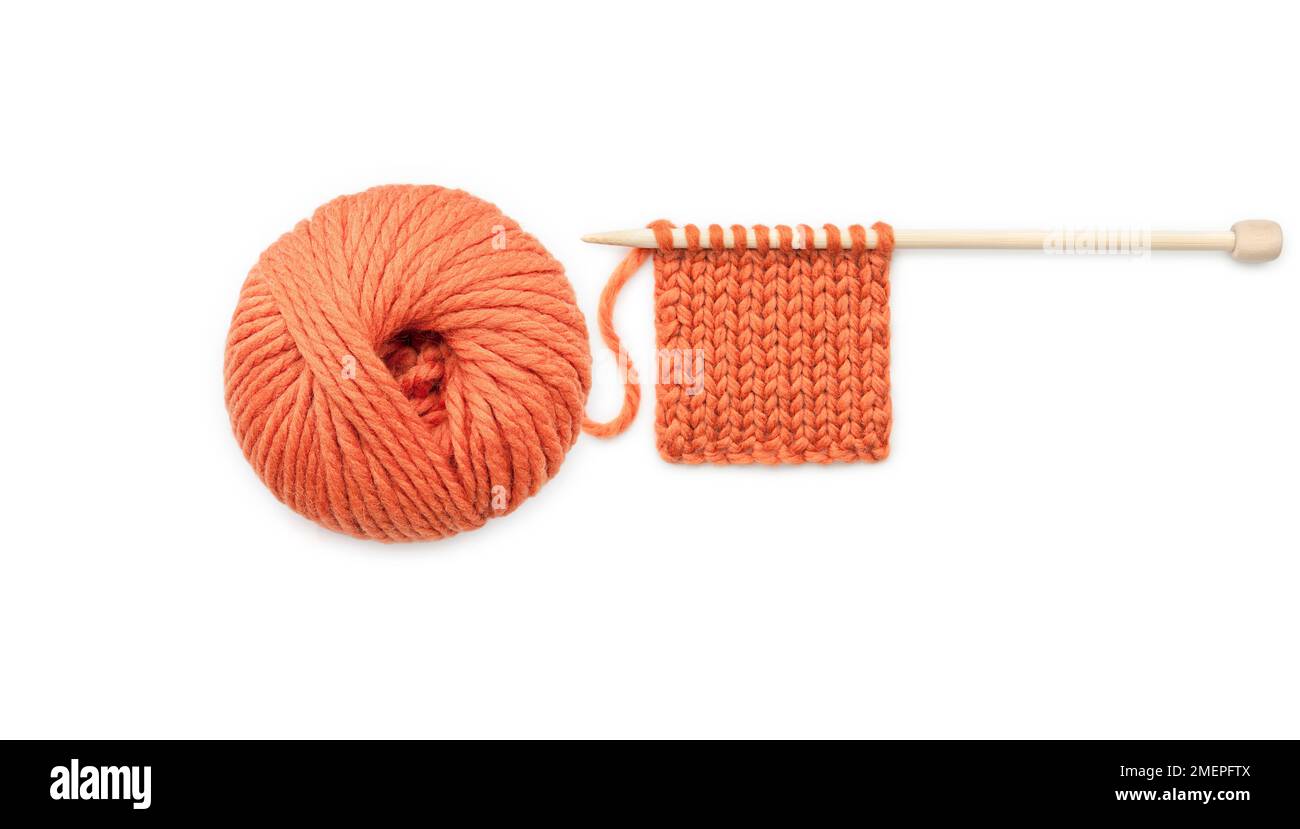 Ball of merino wool and knitted sample on knitting needle Stock Photo ...