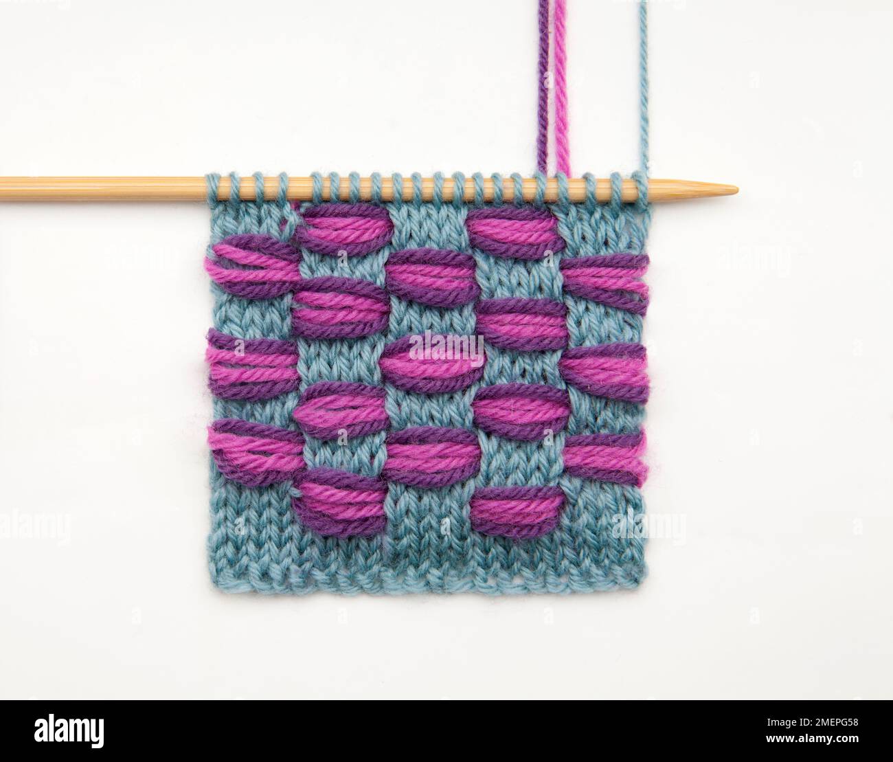 Two strand laying-in colourwork knitting Stock Photo - Alamy
