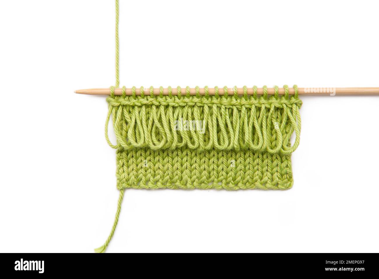 Long loops made with a ruler knitting sample Stock Photo - Alamy