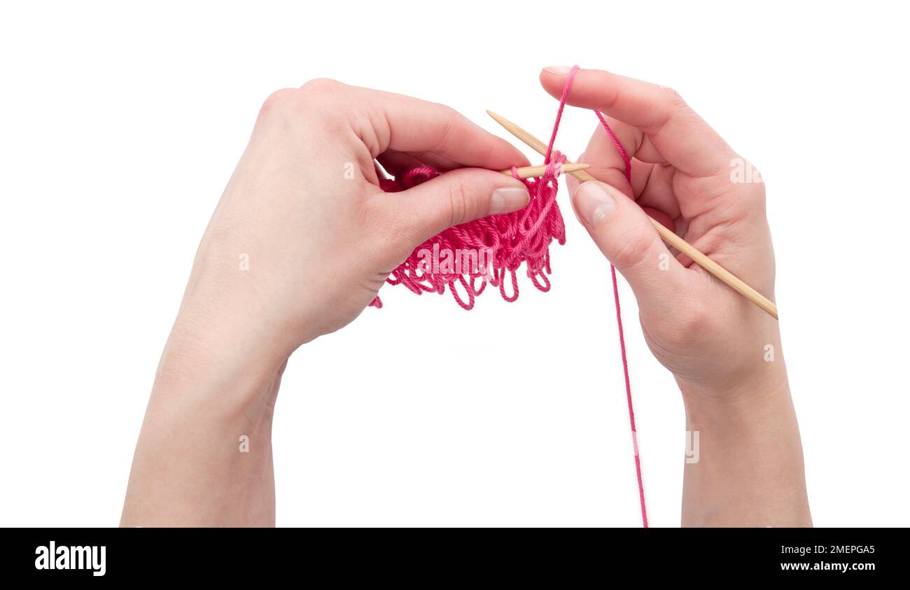 Loops to front knitting technique Stock Photo - Alamy