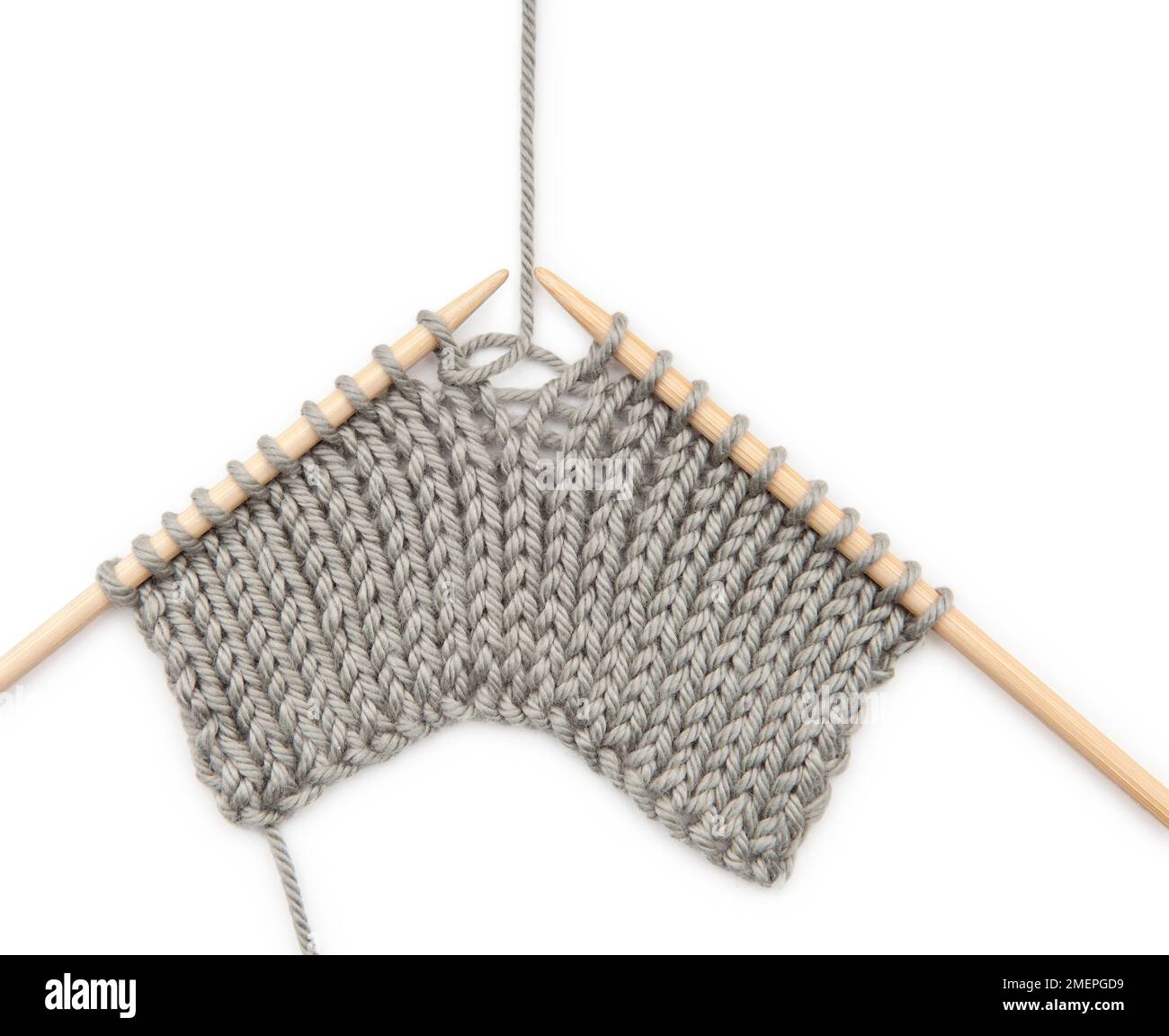 Preventing holes - wrap or tie to close holes knitting technique Stock ...