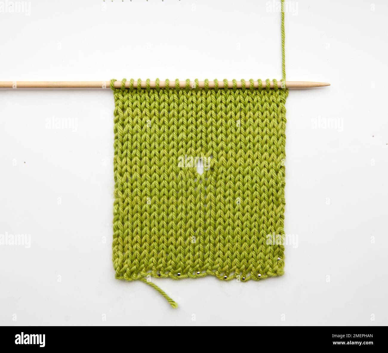 Example of reinforced eyelet buttonhole knitting Stock Photo - Alamy