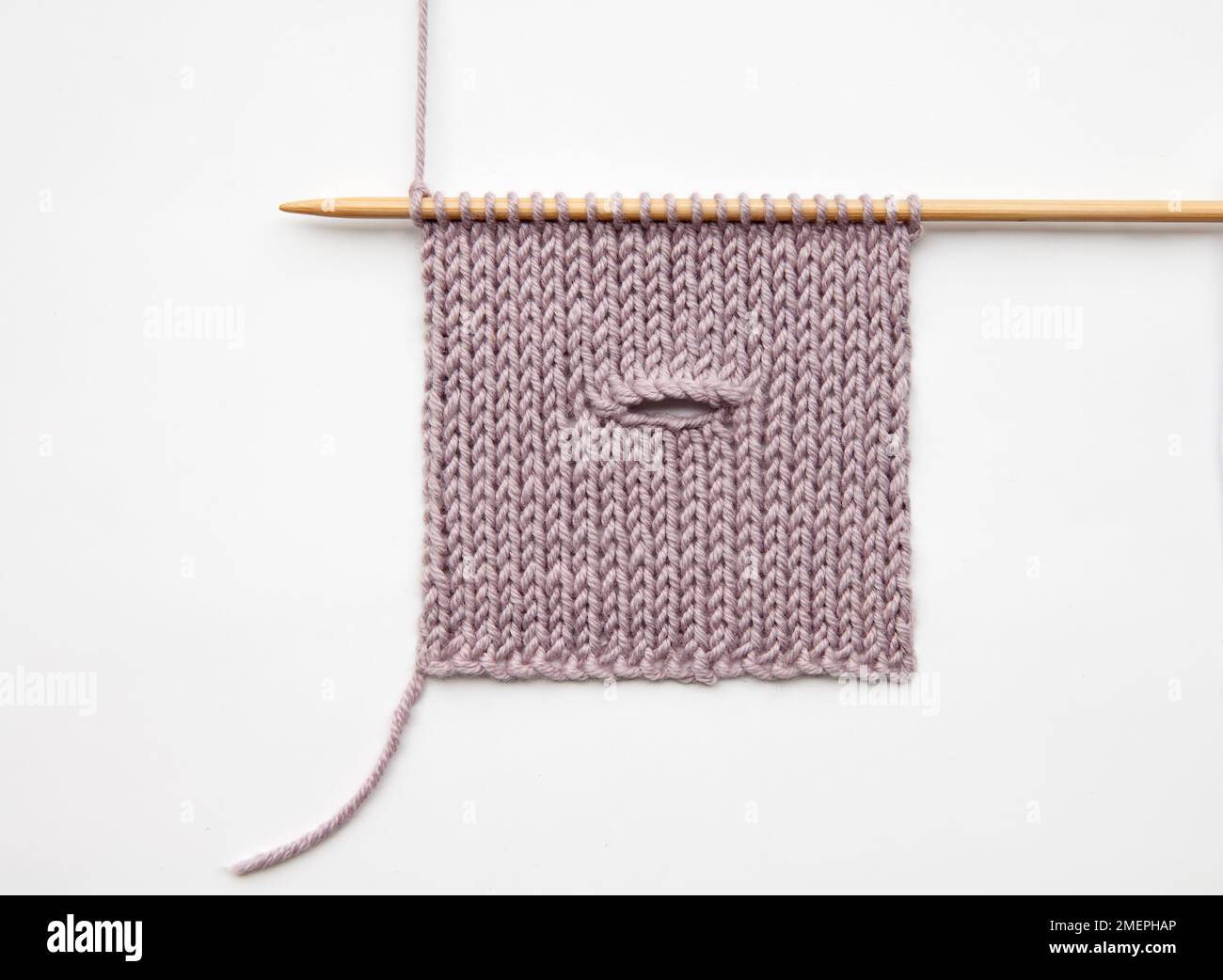 Example of one row horizontal buttonhole knitting Stock Photo - Alamy