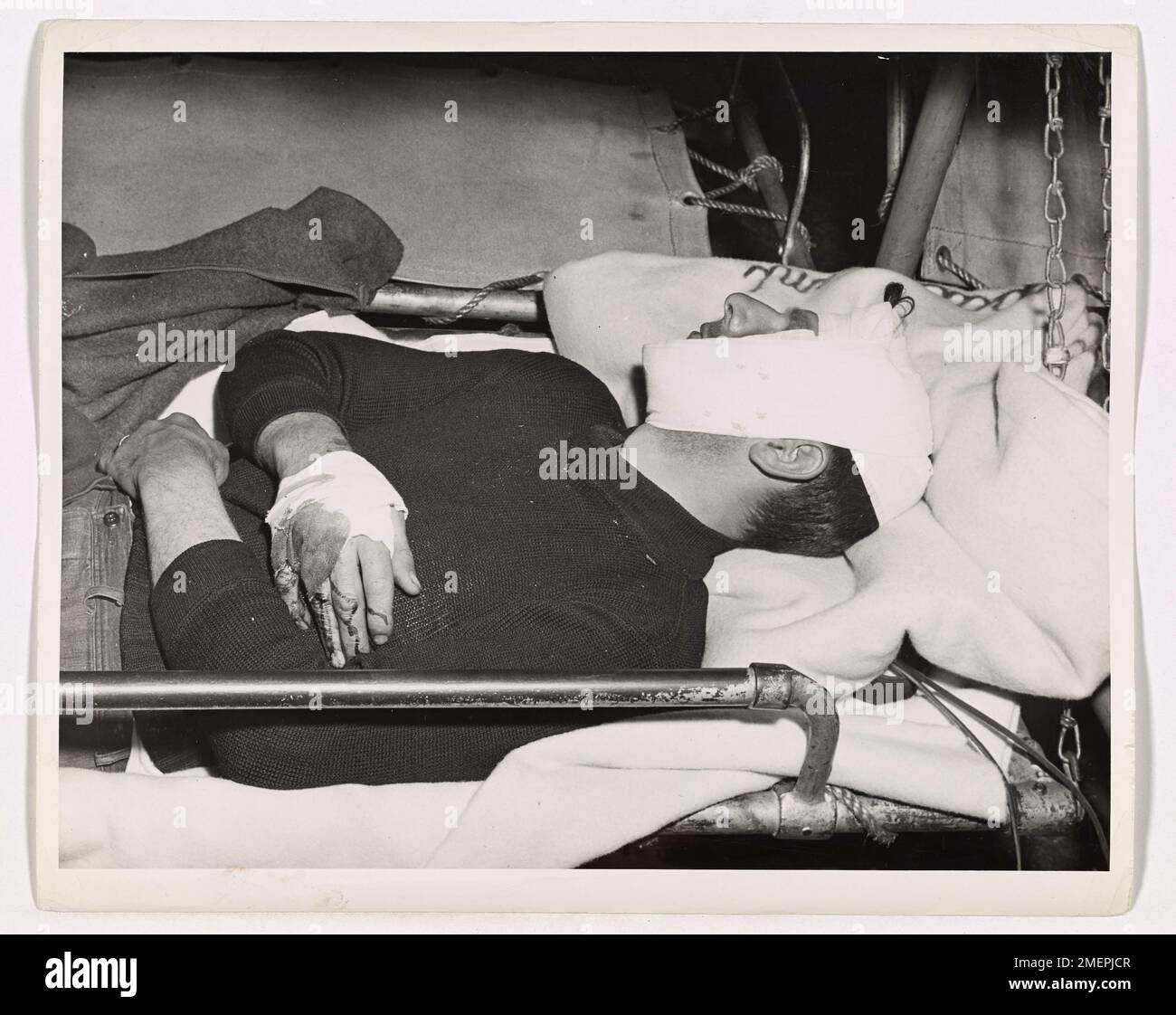 A wounded crew member rests aboard a Coast Guard-manned assault ...