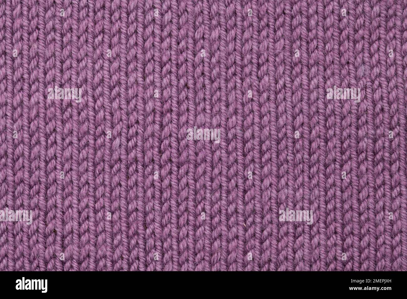 Purple double stitch knitting wool sample Stock Photo - Alamy