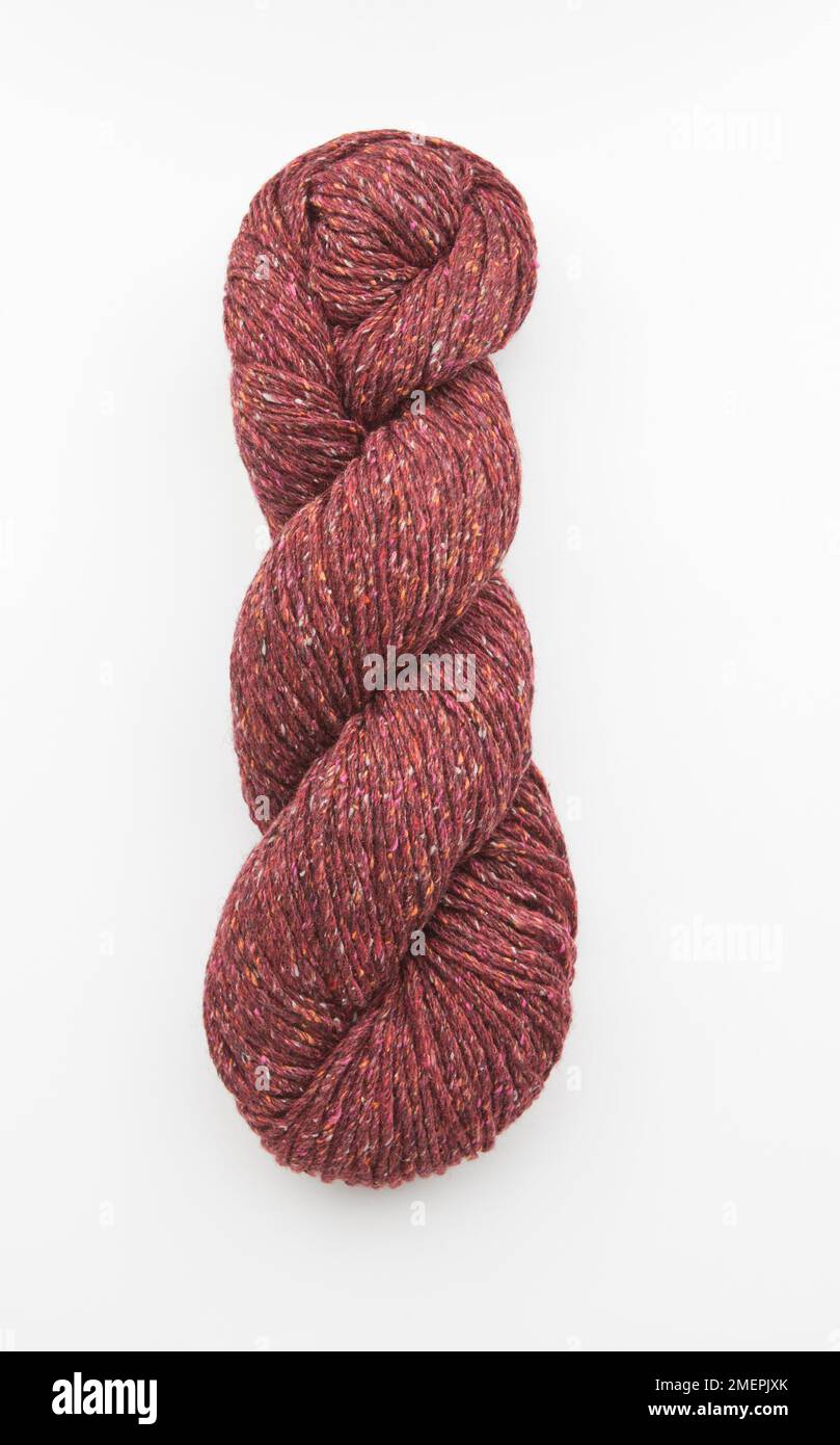 Twist of red silky tweed yarn Stock Photo - Alamy