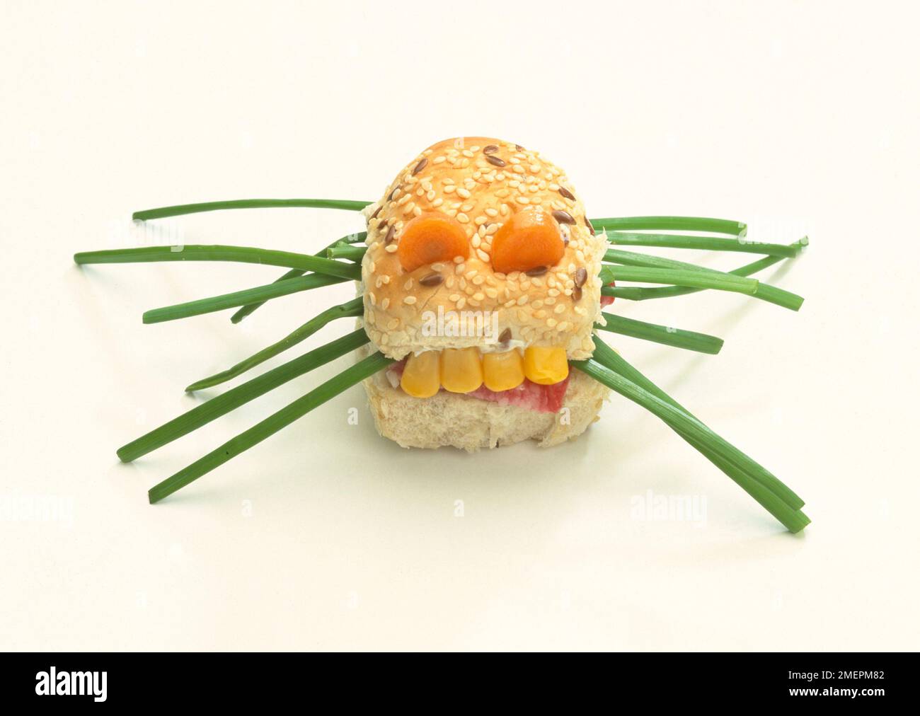 A bread roll made to look like a monster with carrots for eyes ...