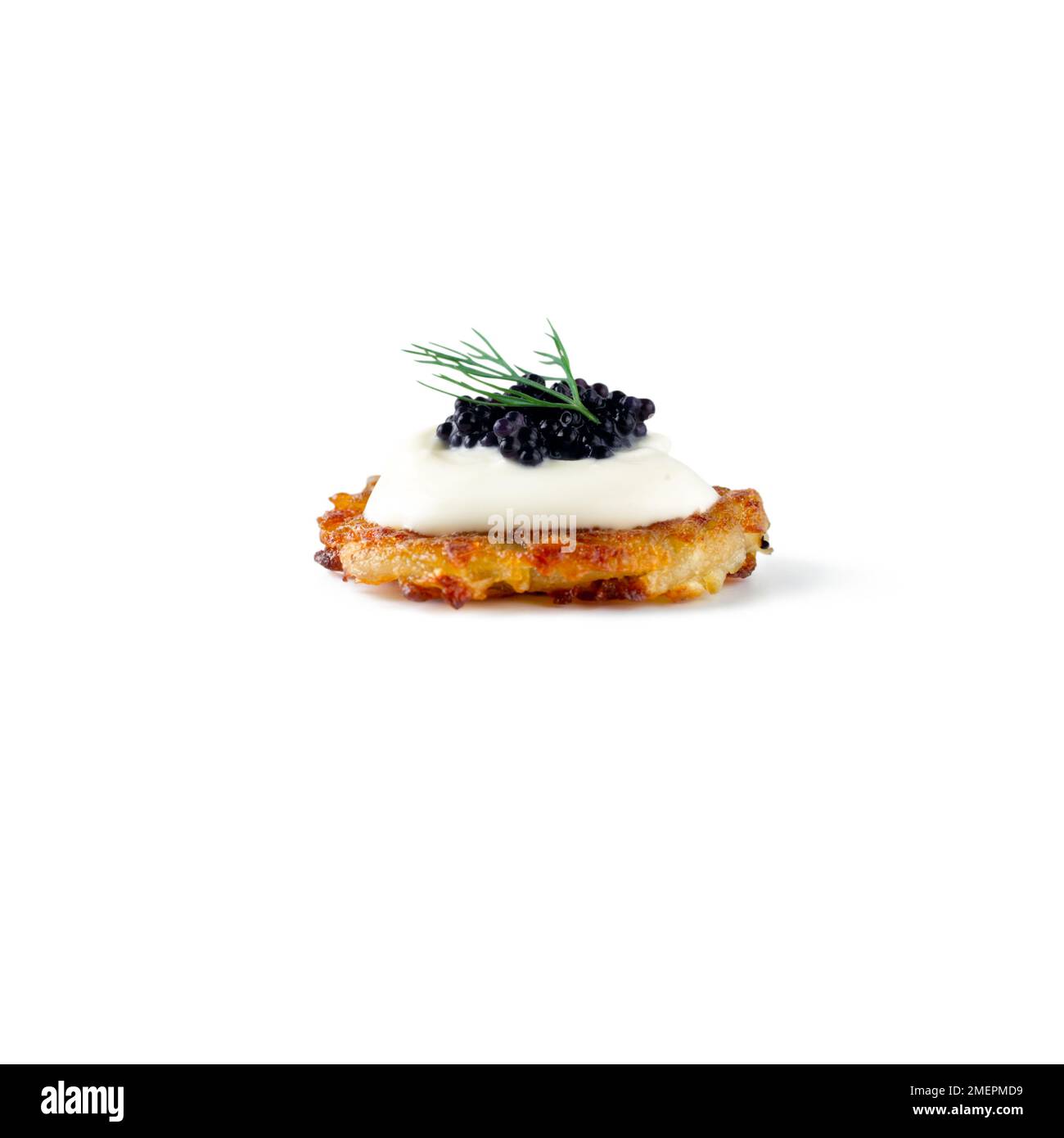 Mini rosti topped with creme fraiche, caviar and dill Stock Photo - Alamy