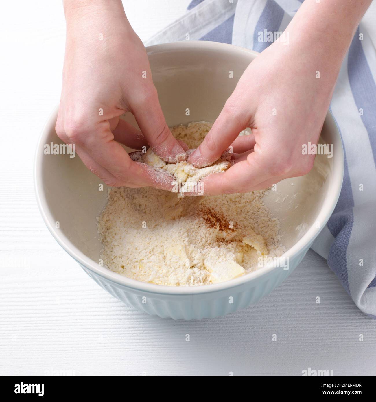 Mixing ingredients for parmesan shortbread in a mixing bowl, including ...