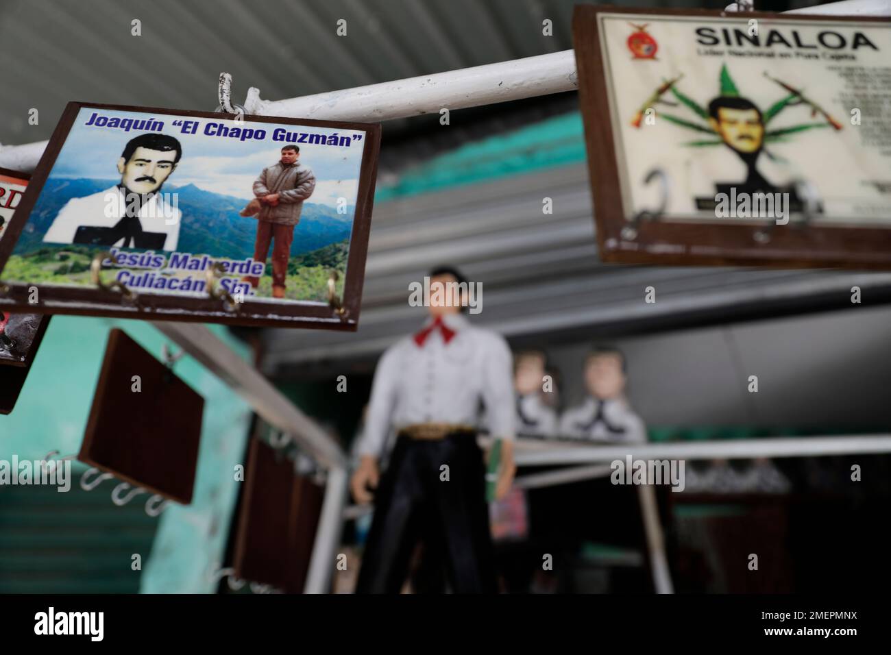Images of Jesus Malverde hang for sale outside a shrine dedicated to ...